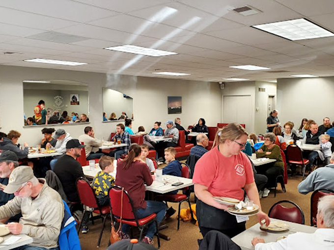 The dining room buzzes with the energy of a place where food matters more than phones. Notice not a single person is taking pictures of their meal.