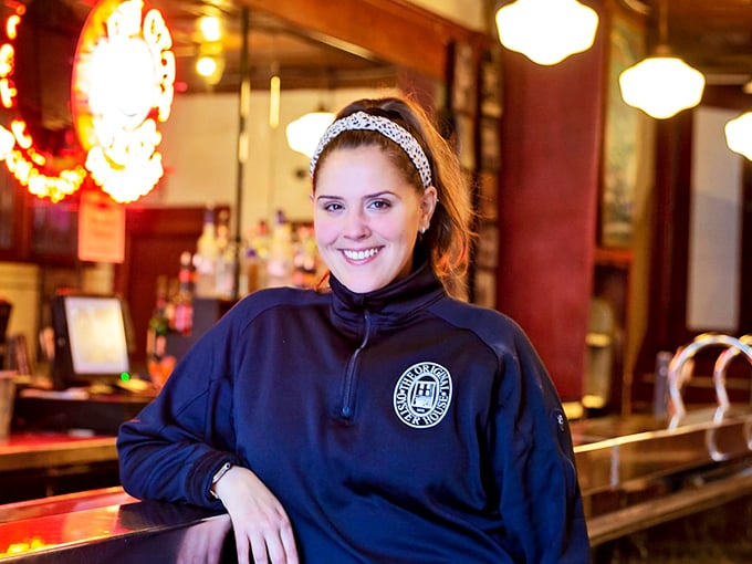 The staff carries on traditions older than most Pittsburgh buildings. That smile says, "Trust me, you're going to love this fish sandwich."