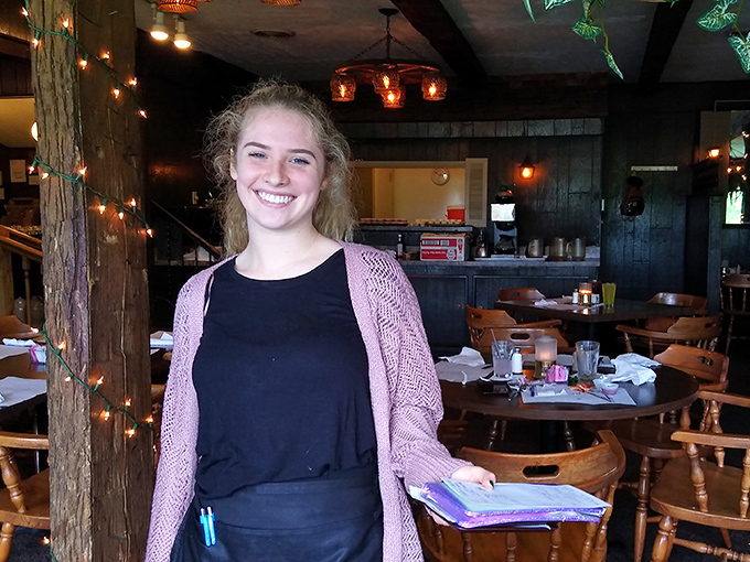 The dining room's warm wood paneling and soft lighting create an atmosphere where calories don't count and diet plans are temporarily suspended.