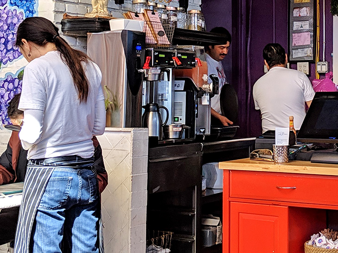 Behind the scenes, the kitchen team works their magic. This is where the French toast dreams become reality, one challah slice at a time.