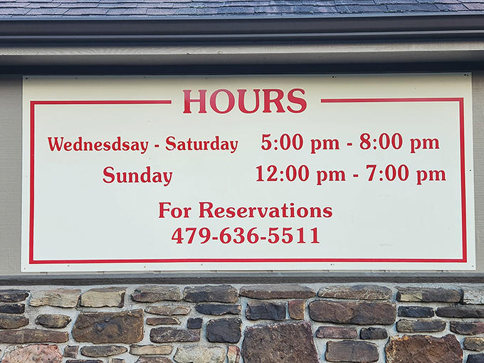 The hours sign tells you everything you need to know &ndash; including that reservations aren't just suggested, they're practically required for this chicken mecca.