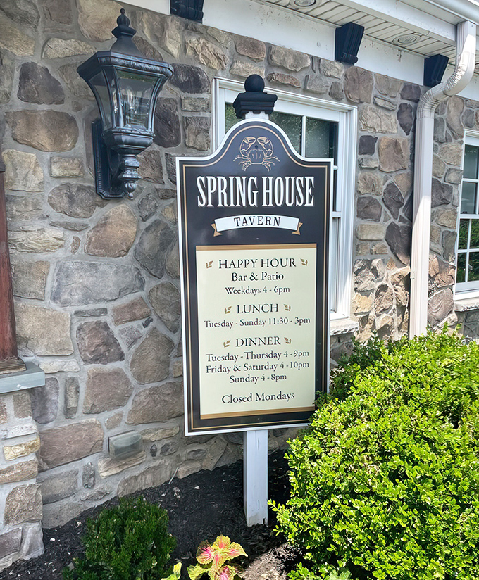 The tavern's sign reveals not just hours but a promise&mdash;happy hour, lunch, and dinner schedules that have structured countless local gatherings since 1719.