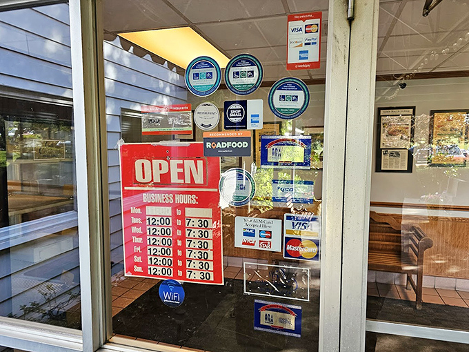 Business hours posted like a promise: "Yes, we'll be here when you need your chicken fix, just like we have been since 1933."