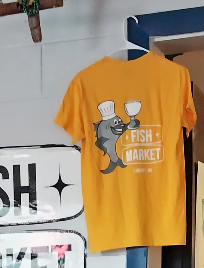 Even the merch tells a story &ndash; a cheerful cartoon fish in a chef's hat holding a wine glass says, "We take our seafood seriously, but not ourselves."
