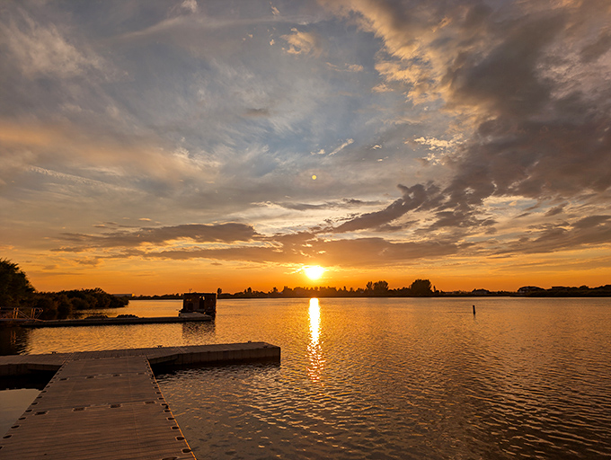 Snake River sunsets perform a daily magic show that would cost hundreds in a tourist town but here unfolds for free, painting the water with liquid gold.