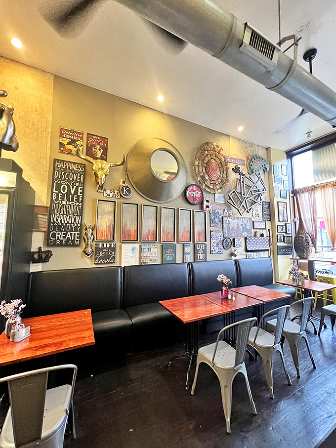 Motivational signs and eclectic art transform simple tables and chairs into a dining space that feeds both body and spirit.