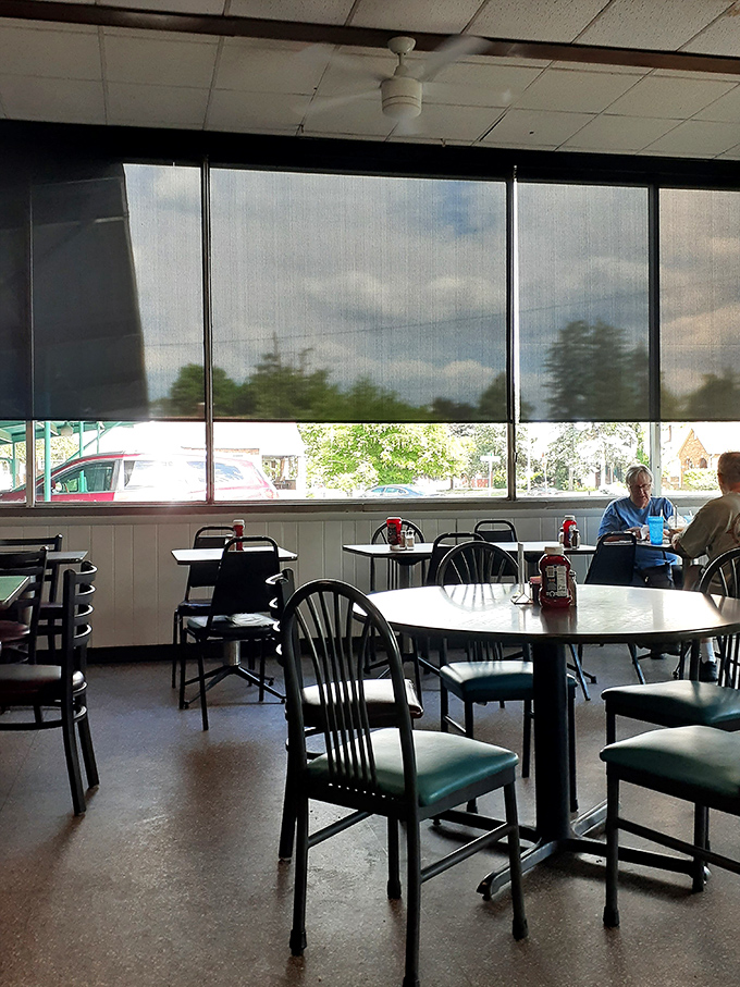 Simple tables with a view to the outside world. Where regulars have claimed their spots for decades of Tuesday morning coffees.