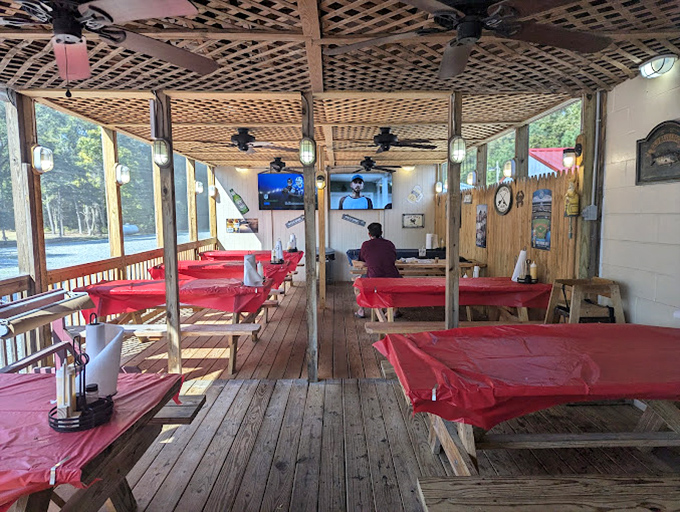 The covered deck at Linton's isn't just a dining area &ndash; it's a community table where strangers become friends over shared crab mallets.