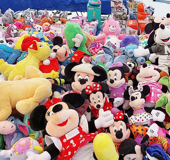 Plush paradise! Disney characters create a soft mountain of childhood nostalgia that's impossible to pass without at least one "aww."