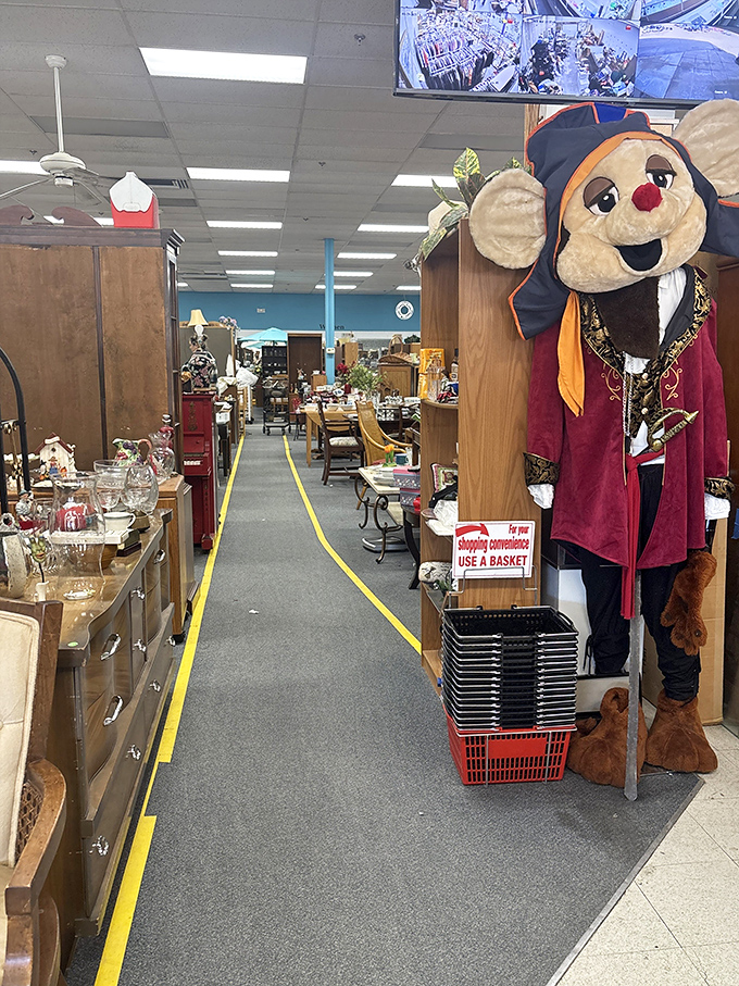 Yellow-lined pathways guide you through departments of possibility. And yes, that is indeed a life-sized mouse mascot standing guard.