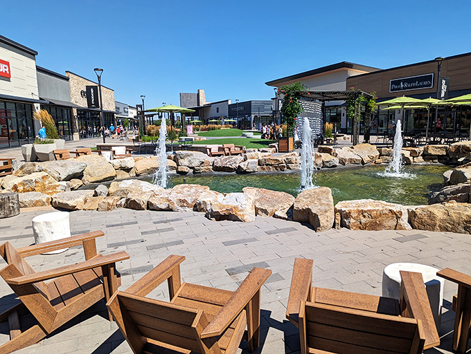 The rock-lined fountain creates a mountain stream vibe in the middle of retail paradise&mdash;Colorado's natural beauty meets commercial convenience.