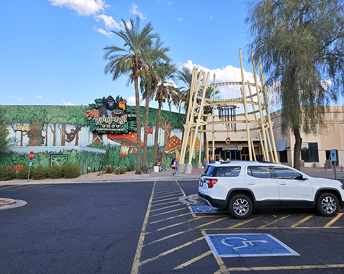 The Rainforest Cafe's exterior hints at the jungle adventure within&mdash;a place where "indoor thunderstorms" are the only weather events Arizonans actually look forward to.