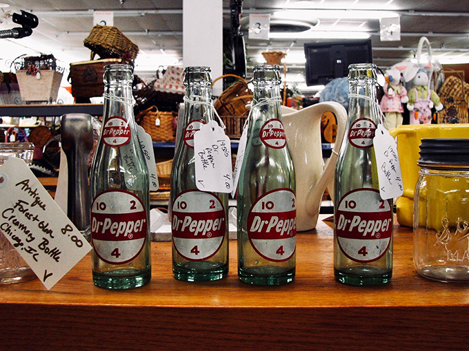 Vintage Dr Pepper bottles stand at attention&mdash;carbonated soldiers from a simpler time when soda came in glass and cost a nickel.