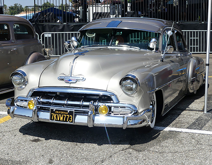 Classic cars occasionally grace the swap meet, like this gleaming piece of automotive history. Chrome dreams from California's golden age of driving.