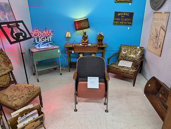 The vibrant blue wall makes this mid-century furniture pop like a retro album cover. That zebra chair has stories to tell.