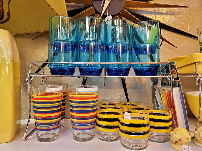 Colorful glassware that makes even tap water feel fancy. Those blue tumblers would make your lemonade taste like it came with a paper umbrella.
