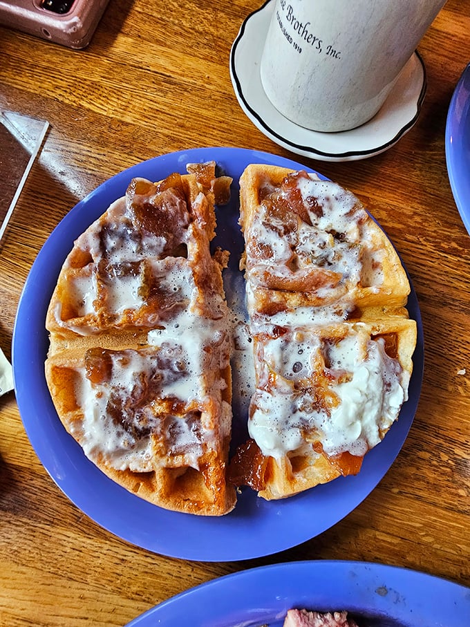 This waffle isn't just split in half&mdash;it's having an identity crisis between dessert and breakfast, and solving it with rivers of melted butter.