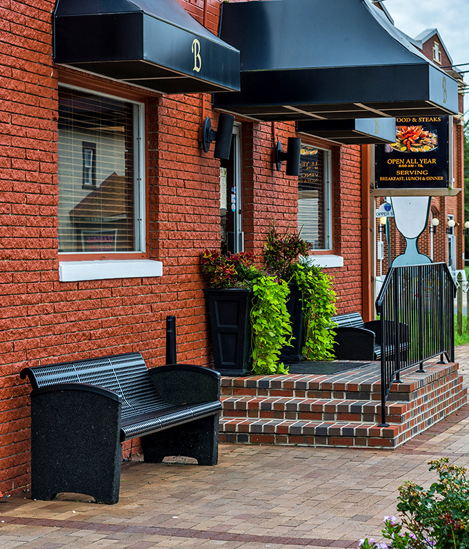 The entrance doesn't just welcome you—it promises a moment of seaside respite with a bench perfectly positioned for post-dinner contemplation.