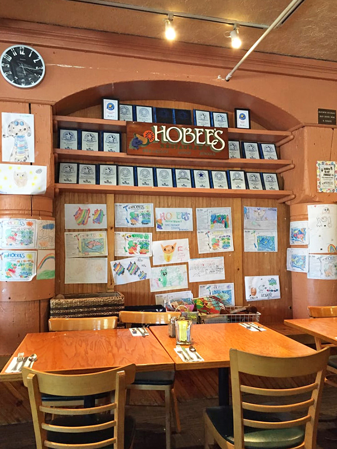 Awards line the walls like badges of honor, while children's artwork below reminds you that Hobee's feeds both bellies and neighborhood pride.