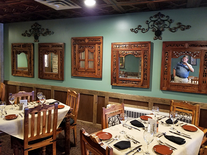 Wooden tables with intricate iron details&mdash;where countless anniversary dinners and business deals have been celebrated.