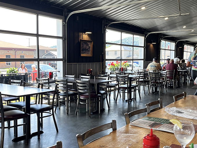 Sunlight streams through large windows, illuminating a dining room where countless carnivorous dreams have come true over the years. 
