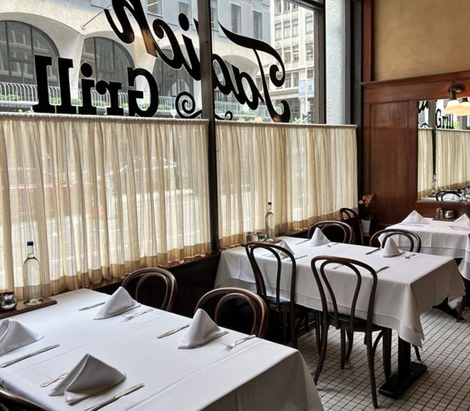 Window seating offers the perfect balance of privacy and people-watching, with those signature white tablecloths that make everything feel special.