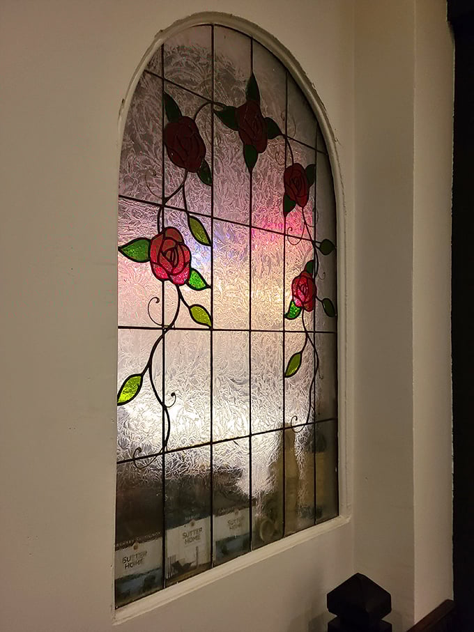 Stained glass roses that have witnessed countless first dates, family celebrations, and "just one more bite" moments.
