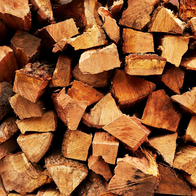 The secret ingredient isn't so secret &ndash; stacks of wood waiting to transform ordinary meat into extraordinary barbecue. Each piece contains future flavor.