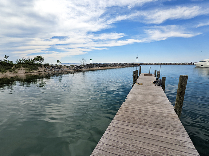 This wooden pier extends into calm waters like a patient invitation to slow down and breathe. 