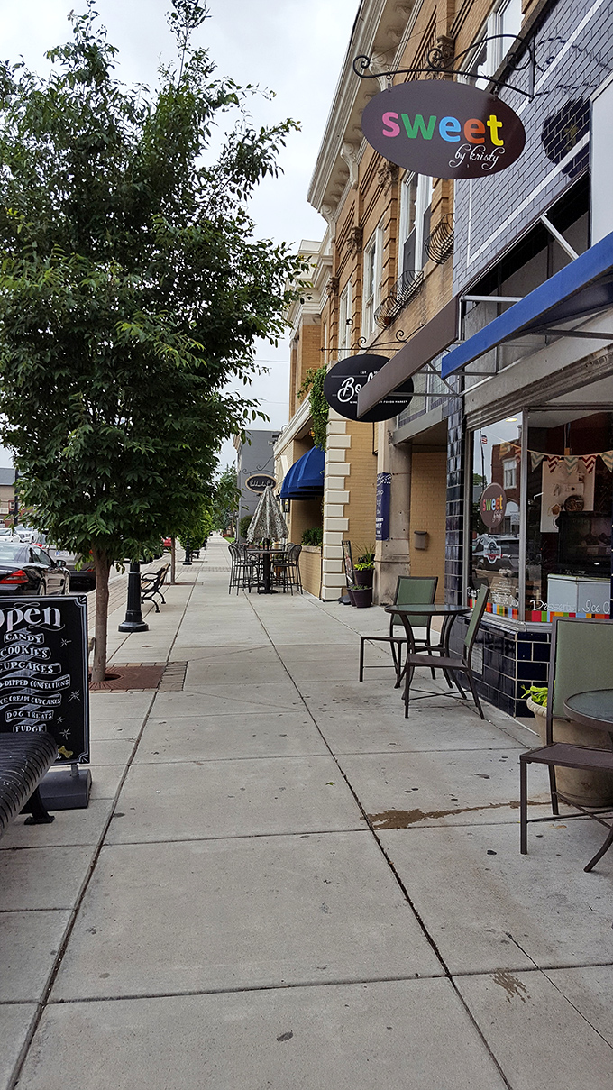 Sweet & Tasty's charming storefront joins other local shops along pristine sidewalks, creating a stroller's paradise of retail therapy opportunities.