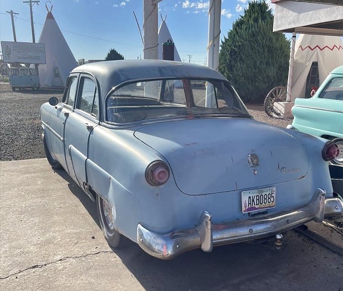 The pale blue '53 Ford Customline seems to be waiting for its owner to return from a malt shop that closed decades ago.