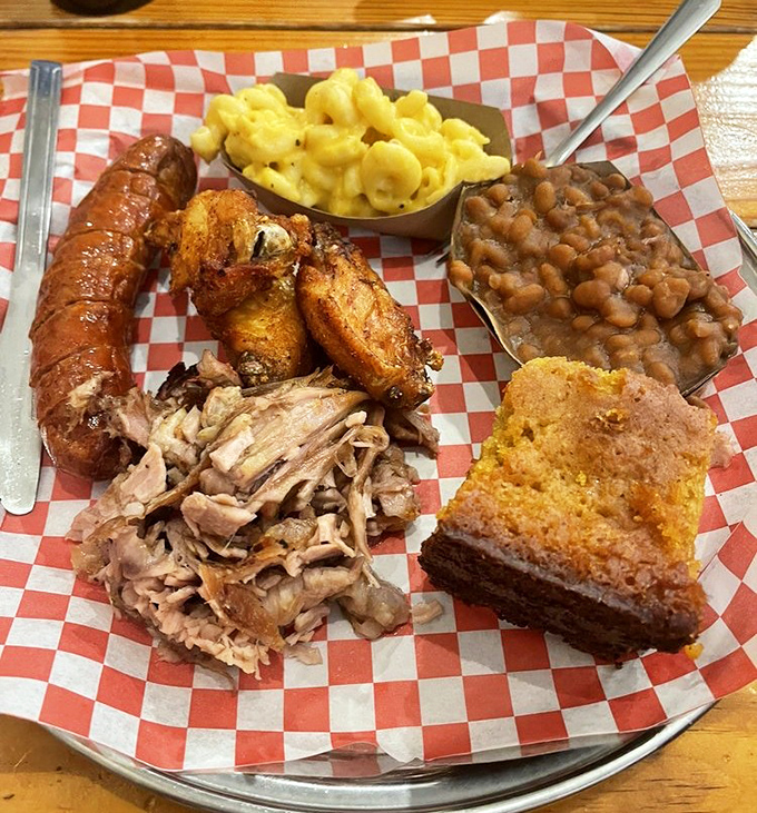 A three-meat plate that answers the eternal question: "Why choose one when you can have it all?" Cornbread included for good measure.