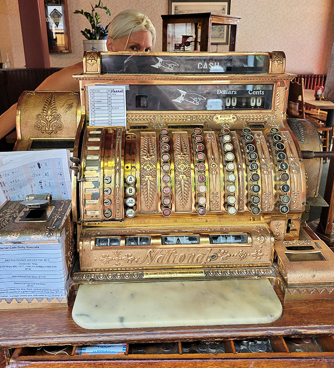 That antique cash register isn't just decoration&mdash;it's a brass-and-gold reminder that some things were simply built to last, including this cafe.