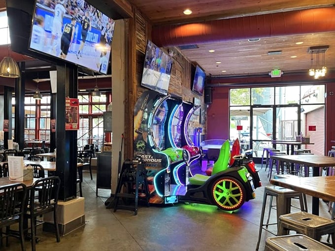 Is that a racing game next to the dining tables? Because nothing says BBQ like virtual NASCAR between courses.