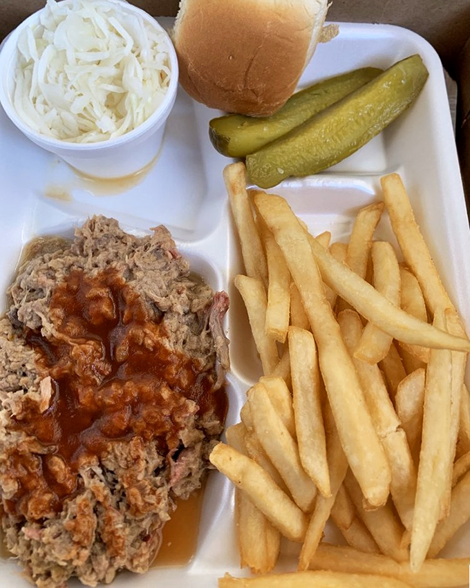 Barbecue that doesn't need fancy presentation, just a puddle of tangy sauce and sides that know their supporting role.