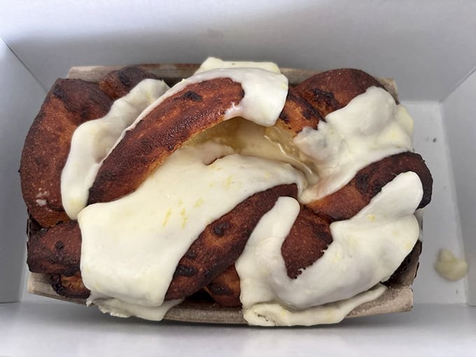 The babka doesn't just have swirls&mdash;it has personality, with cream cheese frosting draped like a couture gown over its cinnamon-scented curves.