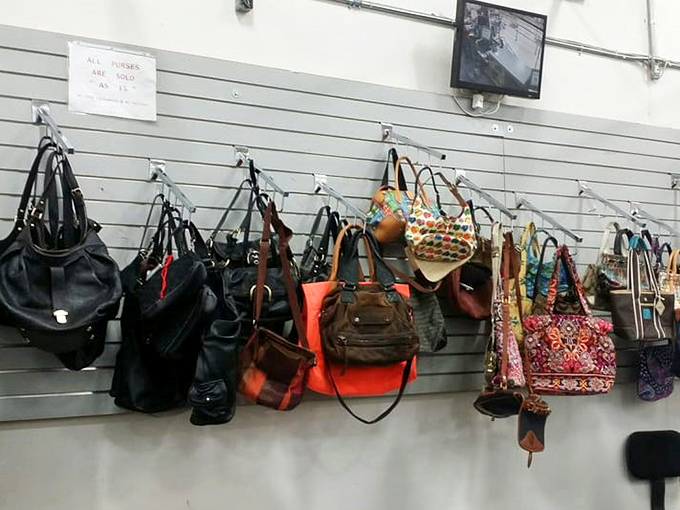 Handbag heaven for the accessory enthusiast. Each purse hanging here represents both significant savings and a previous life of adventure.