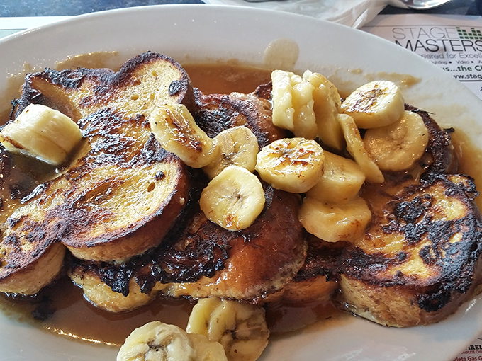 French toast that's had a Caribbean vacation, returning with caramelized bananas and a syrupy tan that makes regular breakfast seem downright boring.