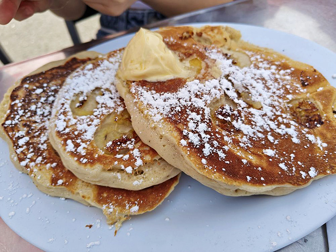 These pancakes don't just arrive at your table&mdash;they make an entrance, dressed in powdered sugar with a butter hat tilted rakishly on top.