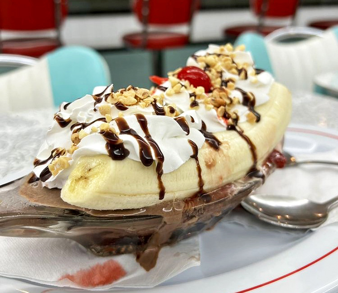 A banana split that defies gravity and good sense. Whipped cream, chocolate drizzle, and nuts create a dessert that's worth every calorie-laden bite.