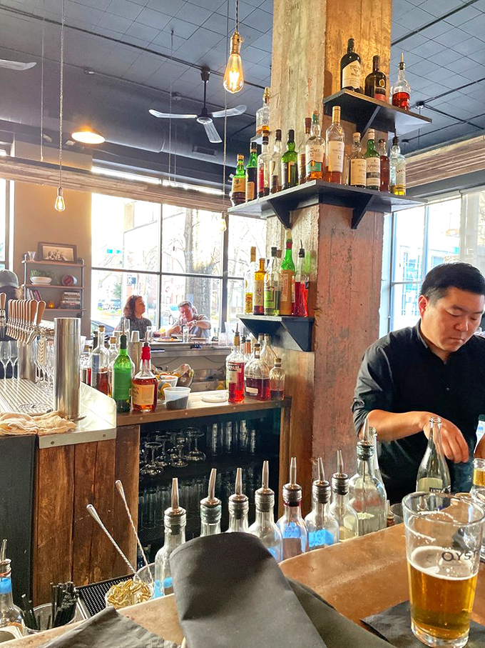 A bar stocked with possibilities. Those bottles aren't just spirits&mdash;they're supporting characters in your evening's delicious narrative.