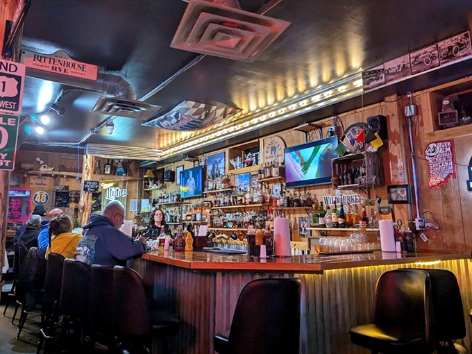 The bar gleams with amber bottles of bourbon while patrons debate the merits of sweet versus spicy barbecue sauce. Indiana's version of philosophy class.