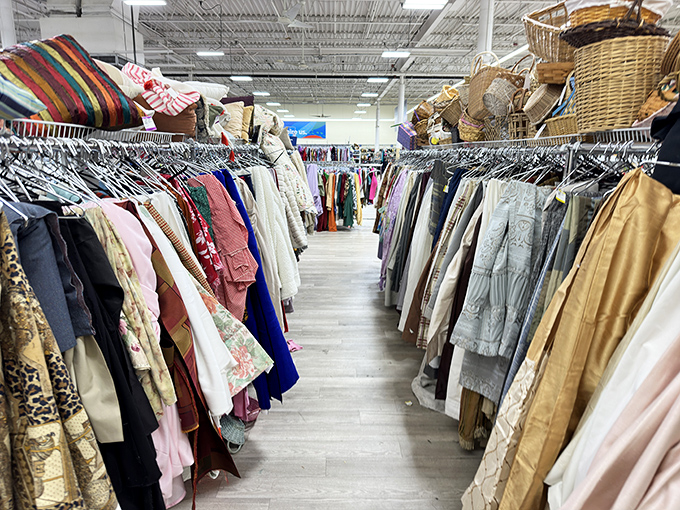 Clothing racks create corridors of possibility where yesterday's fashion donations become tomorrow's wardrobe essentials effortlessly.