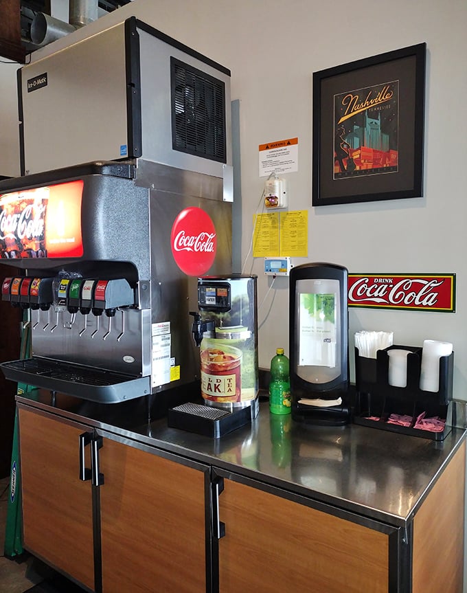 The self-serve beverage station &ndash; an oasis of relief when the heat gets too real. That Nashville poster reminds you exactly where this spicy journey is taking place.