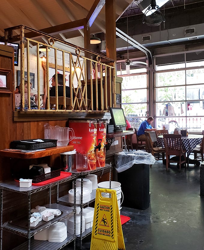 The practical poetry of a well-organized restaurant service station. Those red tea dispensers stand ready like firefighters prepared to extinguish spice emergencies.
