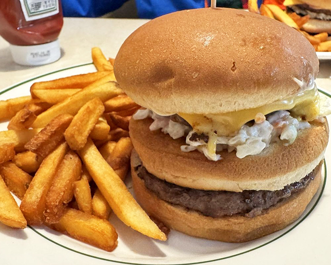 The Big Bud burger&mdash;where "supersize" isn't corporate strategy but Midwestern hospitality. Those fries look like they're auditioning for a food commercial.