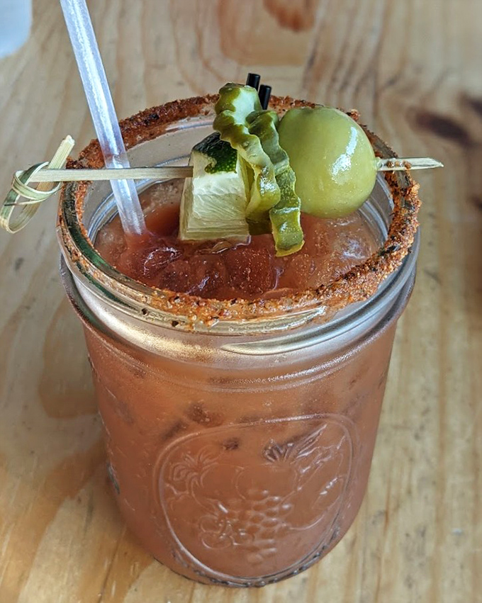 This Bloody Mary isn't just a drink—it's a garden party in a glass. The spiced rim and veggie garnish make "getting your vitamins" deliciously adult.