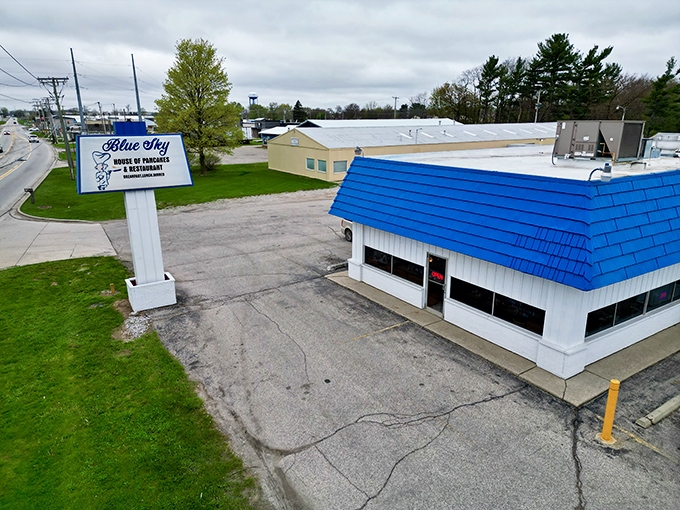 Blue Sky's bright roof signals comfort food ahead—the kind that makes diets take sudden, temporary vacations.