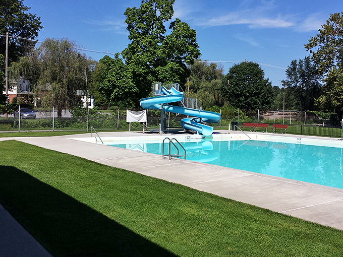 A community pool with a slide that's responsible for more summer memories than ice cream trucks and fireflies combined.