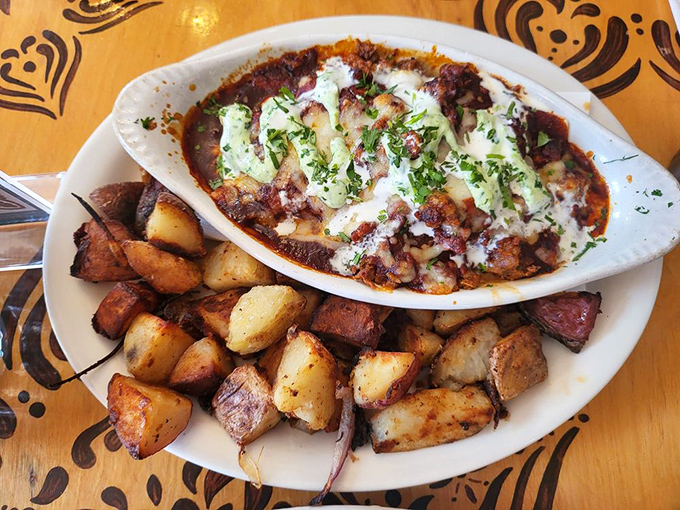 This hearty dish looks like what would happen if breakfast and dinner had a delicious love child, topped with melty cheese and herbs.